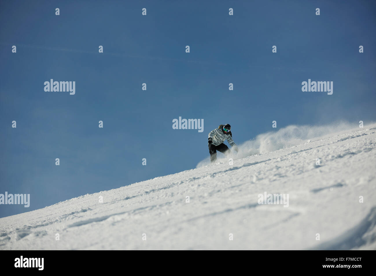 snowboard woman racing downhill slope and freeride on powder snow at ...