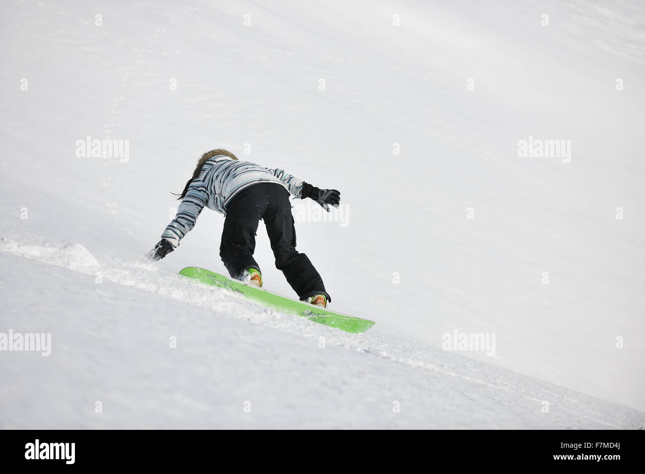 freestyle snowboarder jump and ride free style at sunny winter day on ...