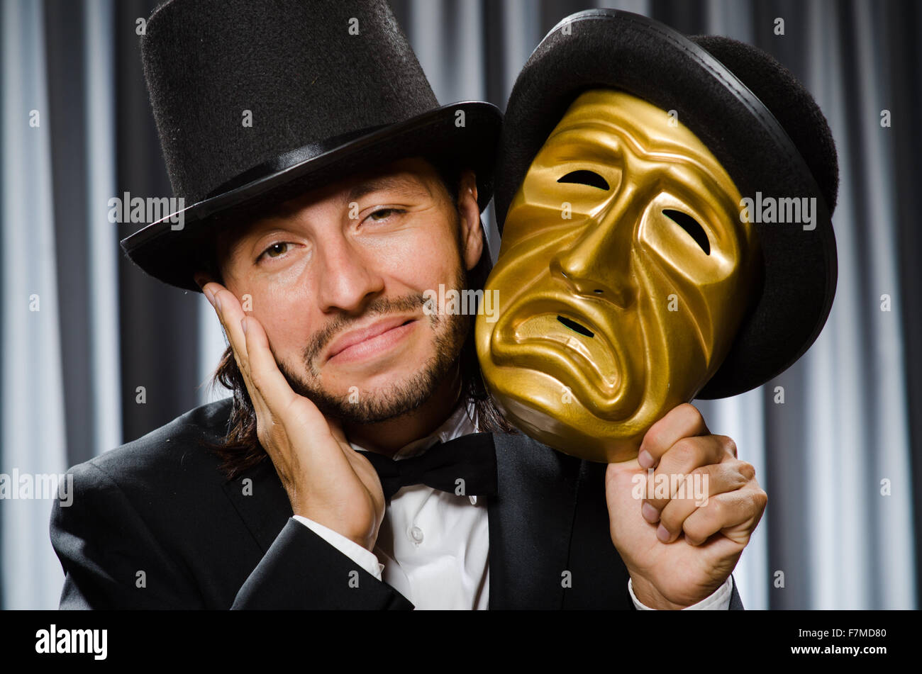 Funny concept with theatrical mask Stock Photo - Alamy