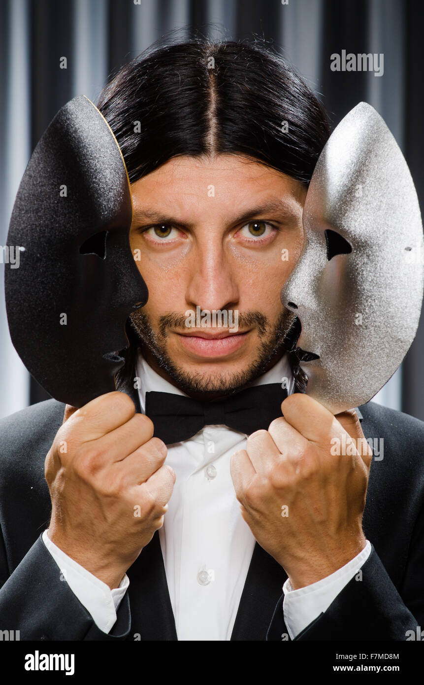 Funny concept with theatrical mask Stock Photo - Alamy