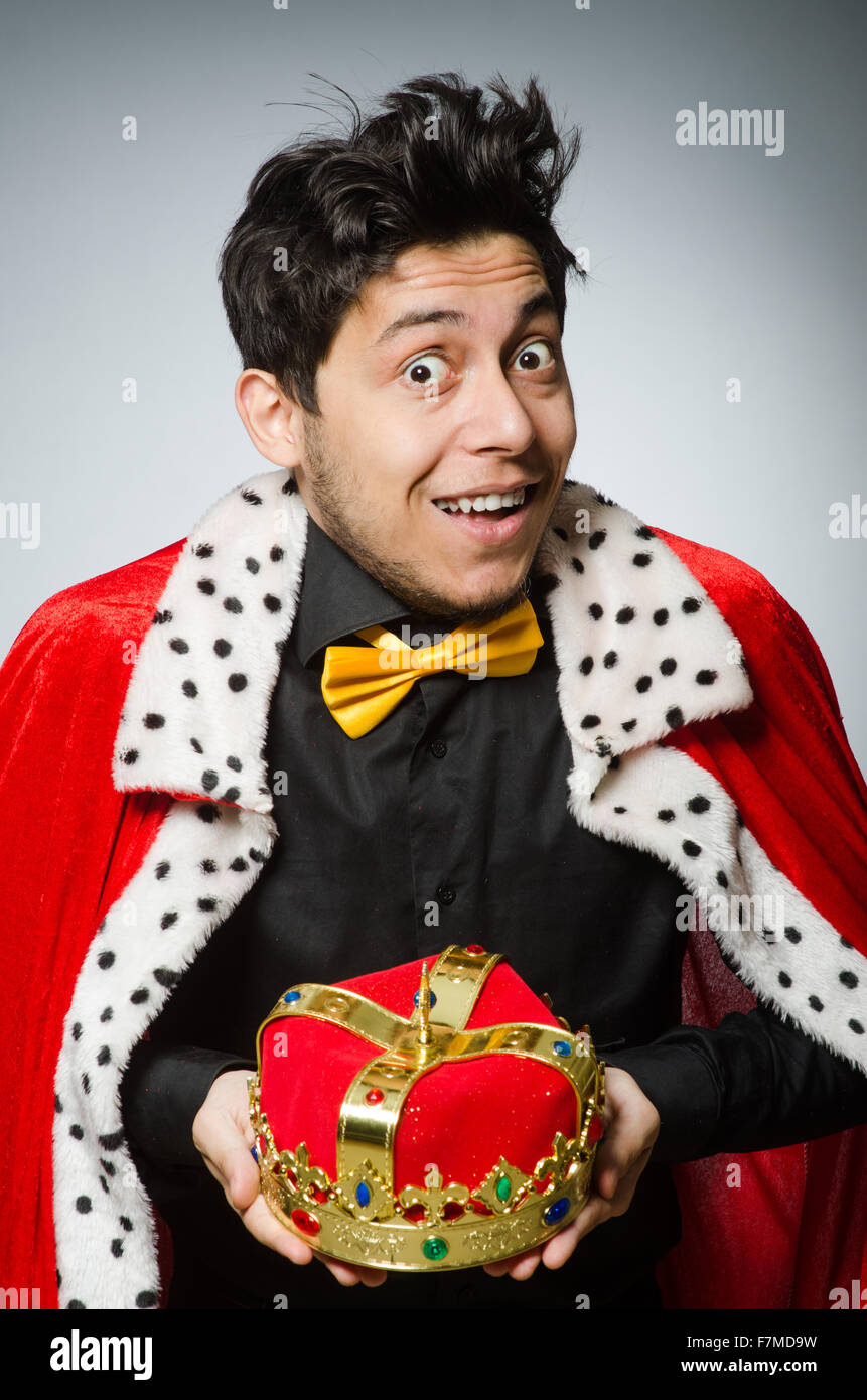 Concept with funny man wearing crown Stock Photo - Alamy