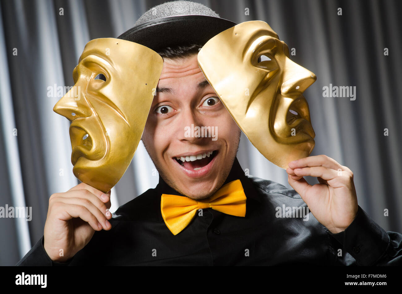 Funny concept with theatrical mask Stock Photo - Alamy