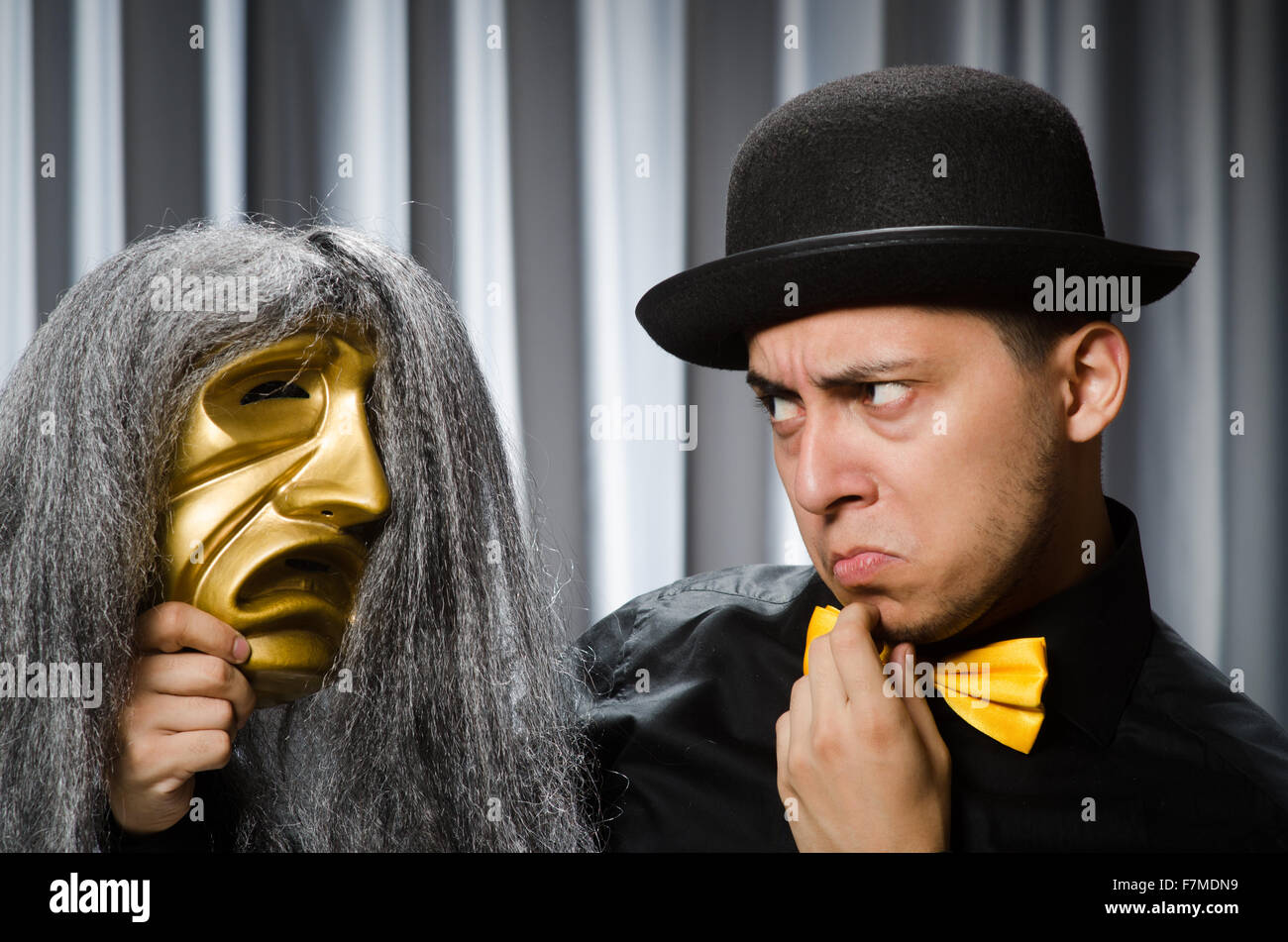 Funny concept with theatrical mask Stock Photo - Alamy