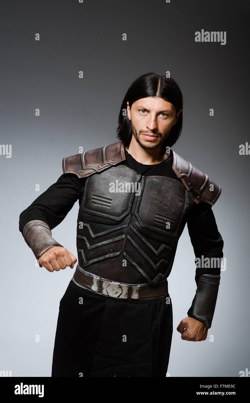 Angry warrior against dark background Stock Photo - Alamy