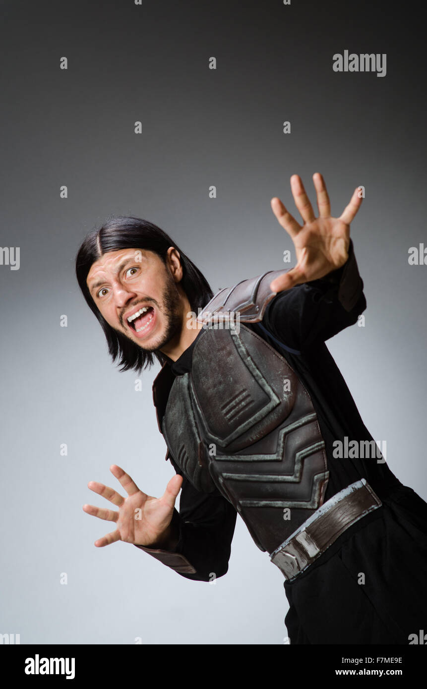 Angry warrior against dark background Stock Photo - Alamy