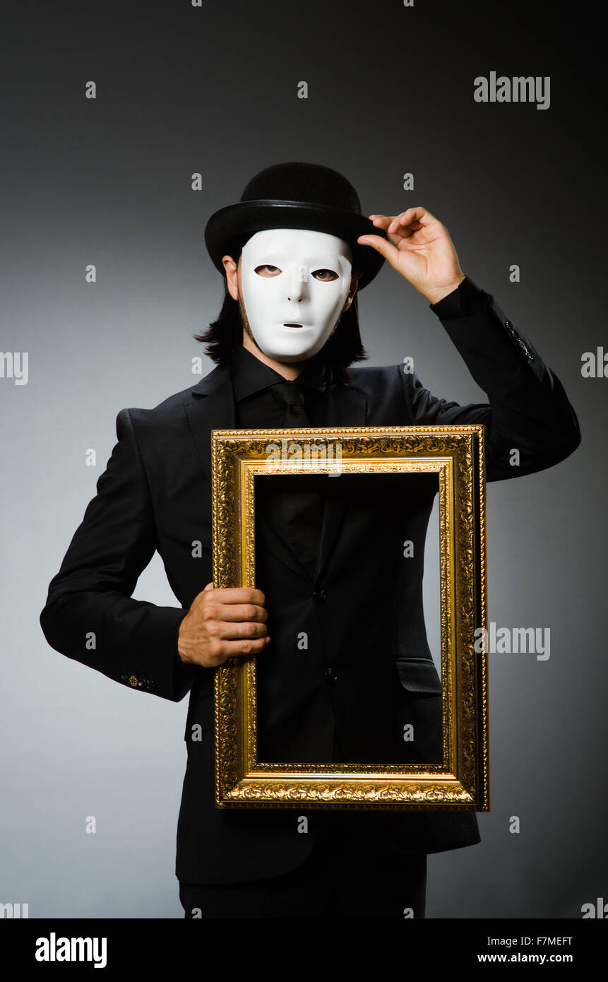 Funny concept with theatrical mask Stock Photo - Alamy