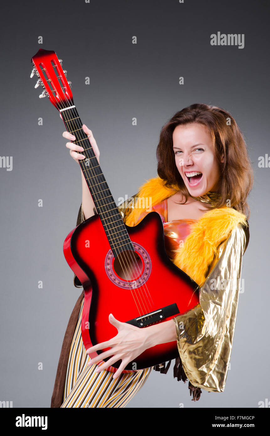 Guitar player with red instrument Stock Photo - Alamy