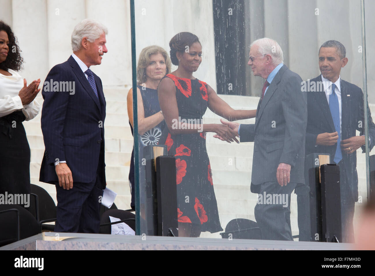 Former President Jimmy Carter shakes hands with First Lady Michelle ...