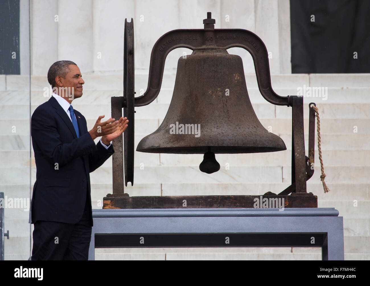 U.S. President Barack Obama claps next to Bell from the Birgmingham ...