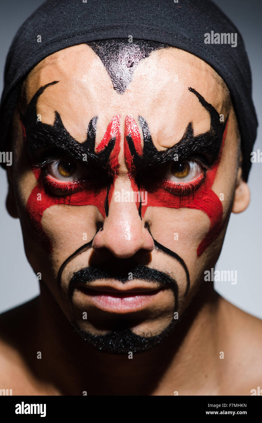 Man with face covered with facepaint Stock Photo - Alamy