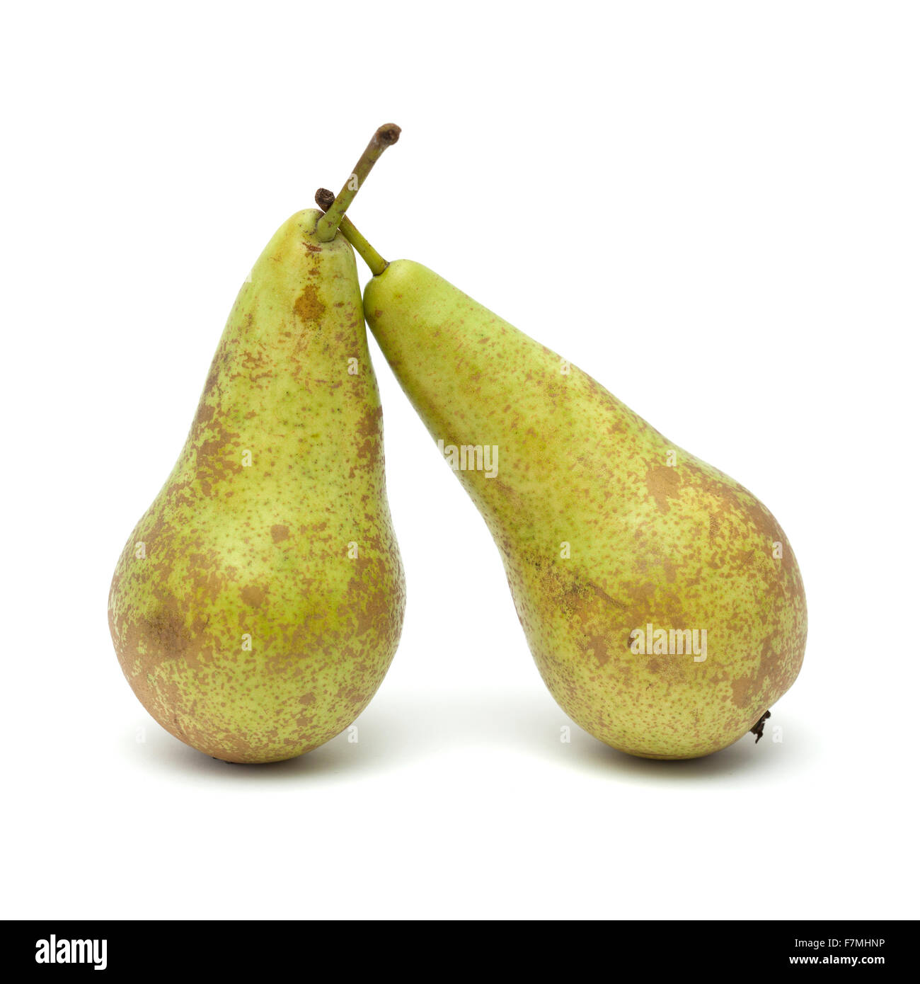 two green Conference pears isolated on white background Stock Photo - Alamy