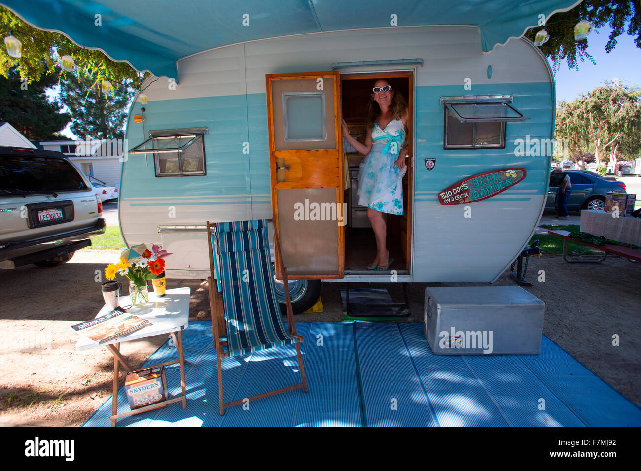 Girl with sunglasses stands in front of vintage 1954 Jewell trailer at ...