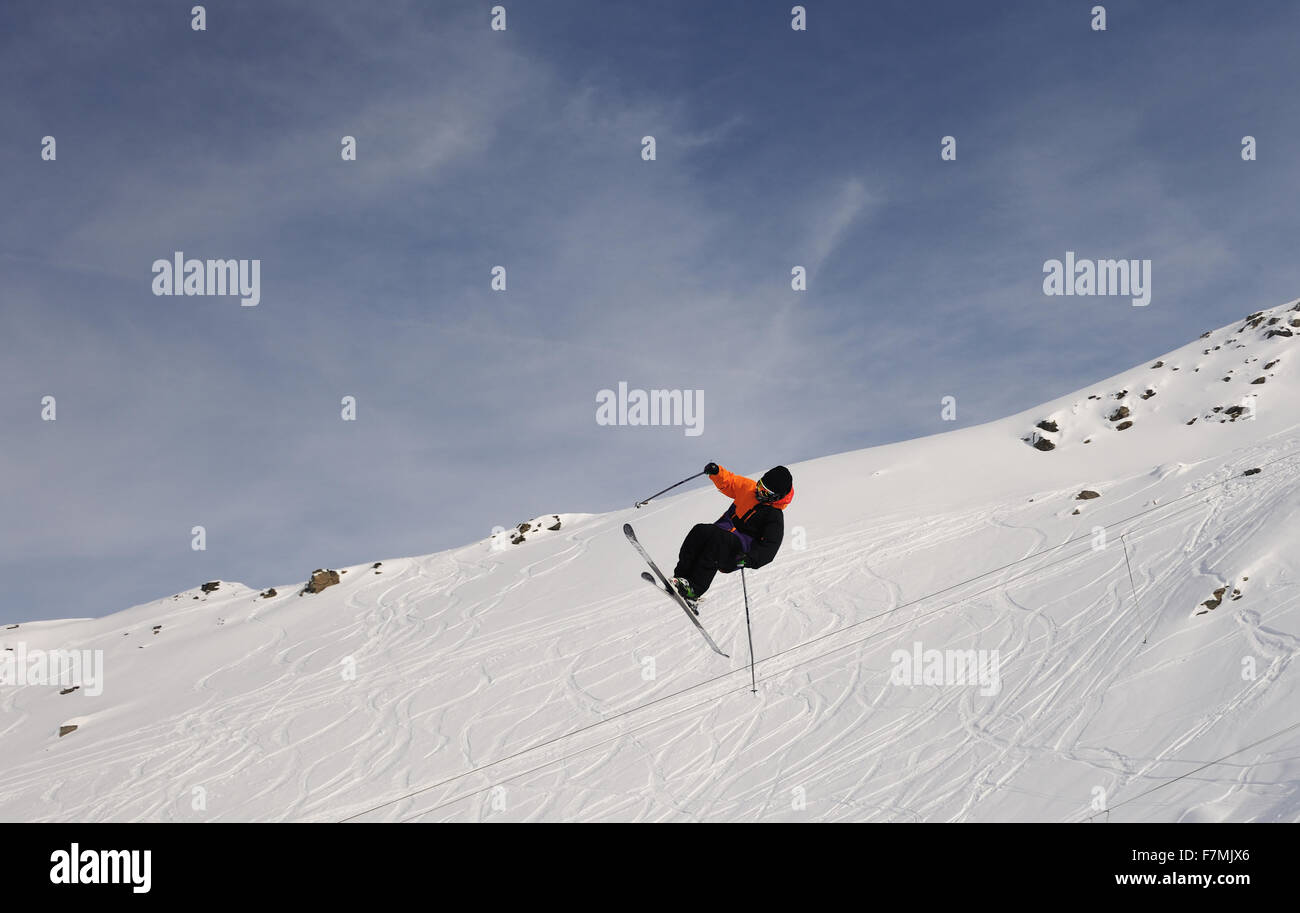 extreme freestyle ski jump with young man at mountain in snow park at ...