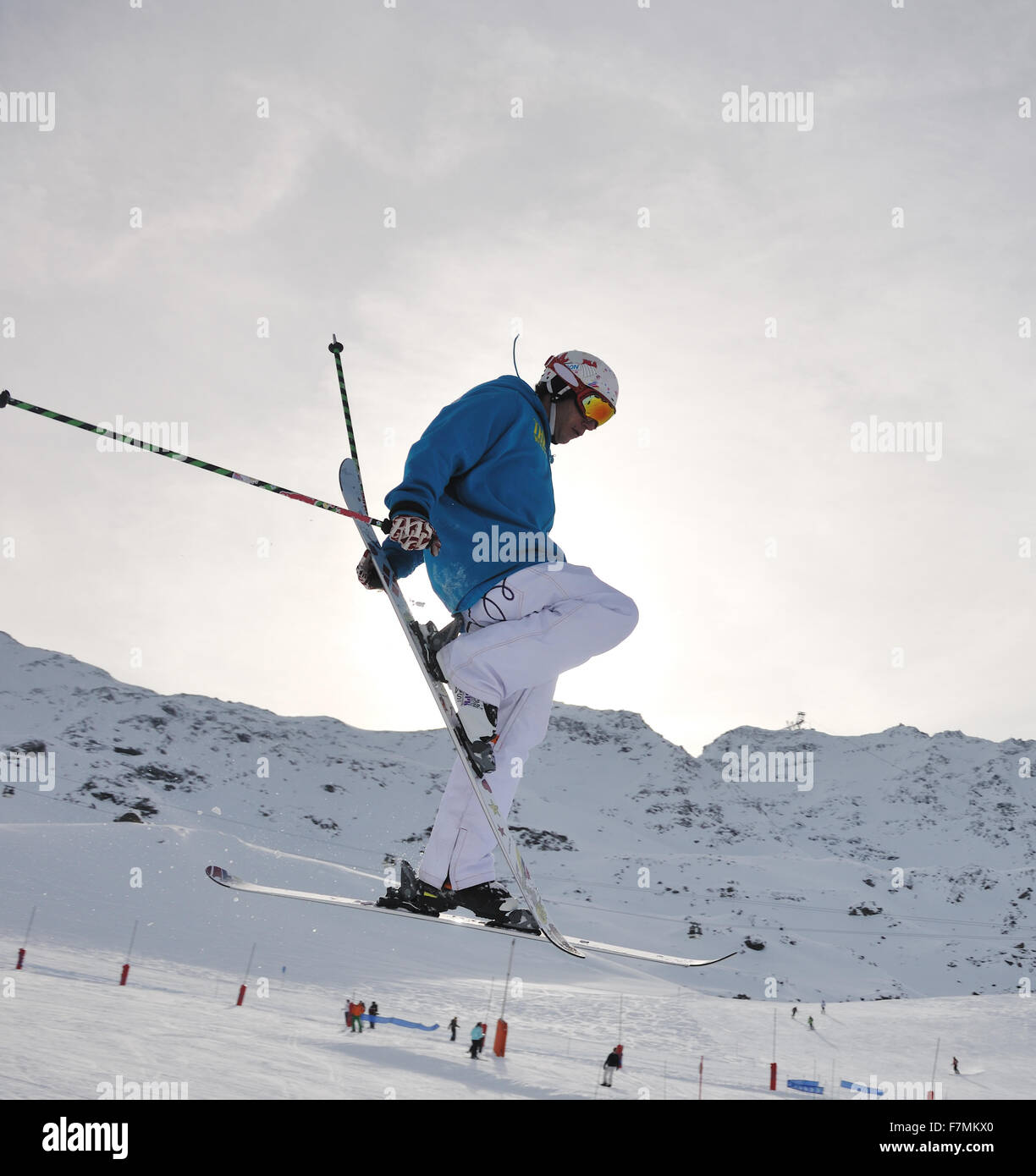 extreme freestyle ski jump with young man at mountain in snow park at ...