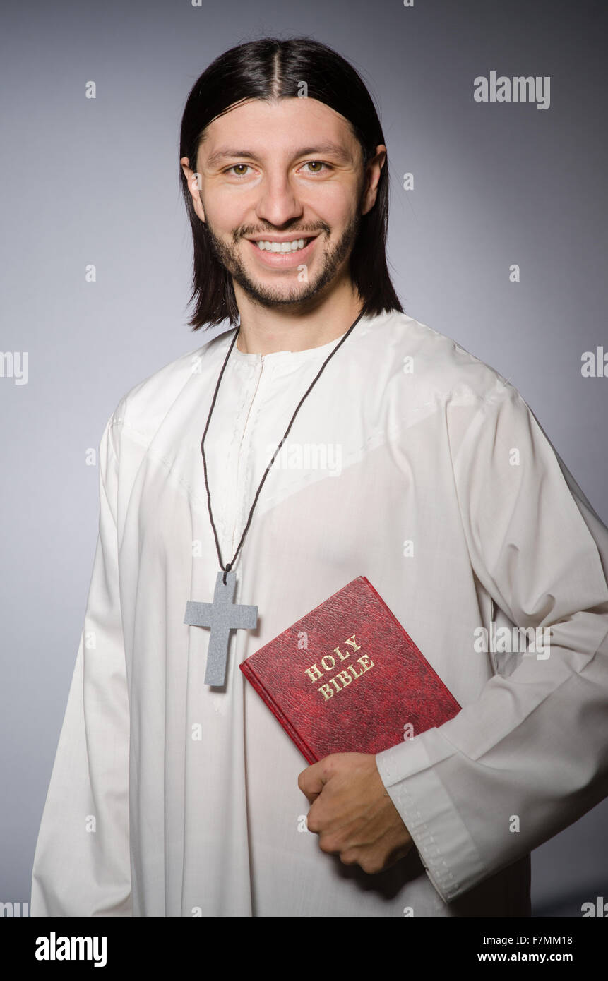 Priest man in religious concept Stock Photo - Alamy