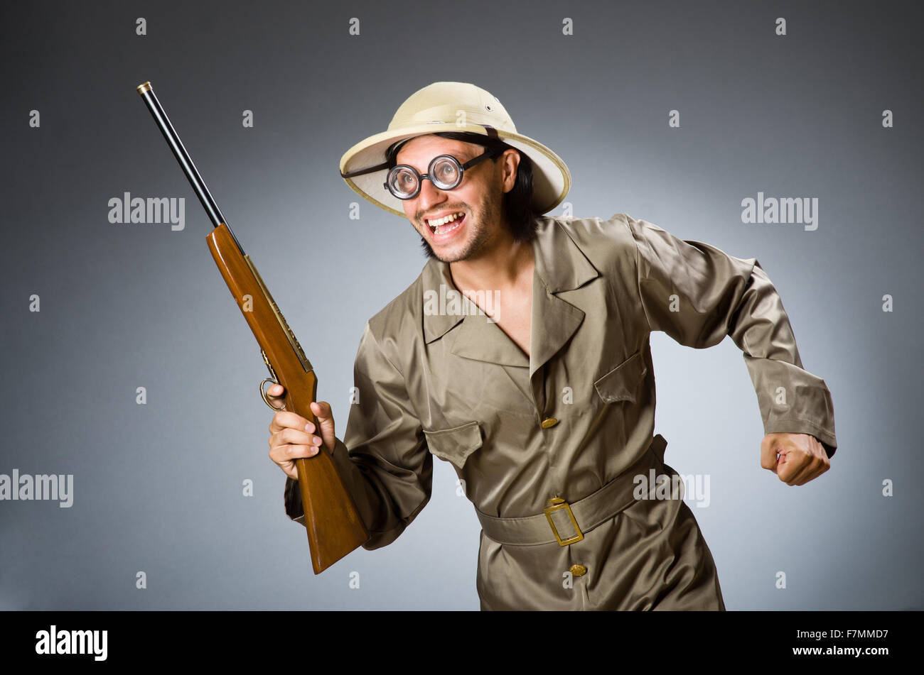 Funny safari hunter with rifle Stock Photo - Alamy