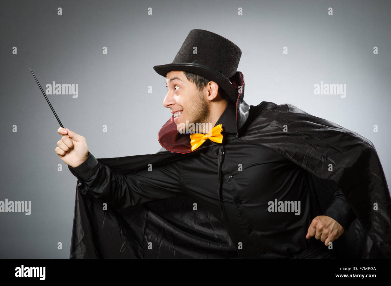 Funny magician man with wand and hat Stock Photo - Alamy