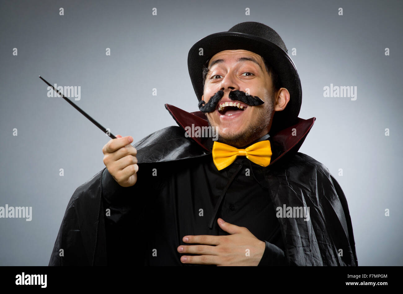Funny magician man with wand and hat Stock Photo - Alamy