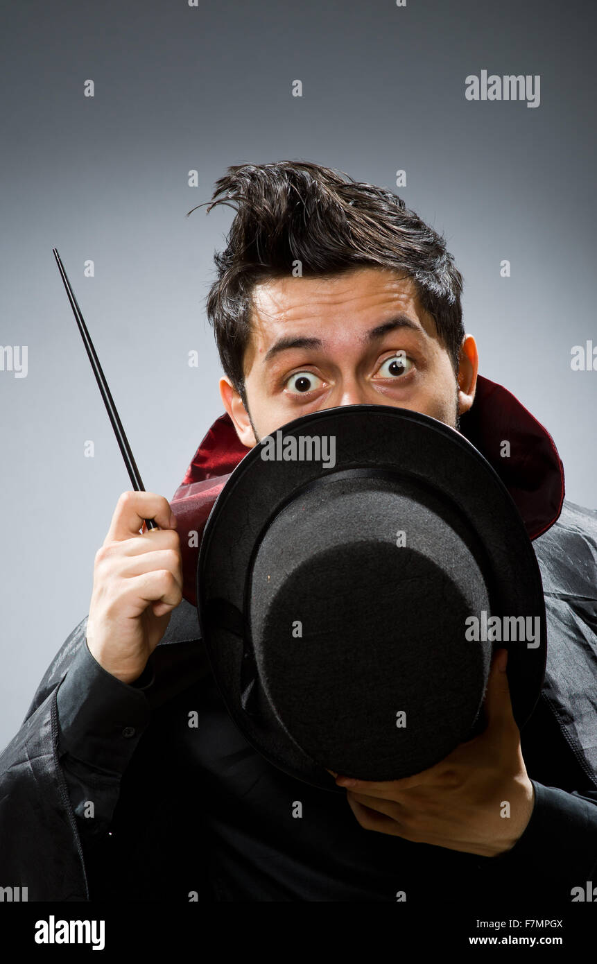 Funny magician man with wand and hat Stock Photo - Alamy