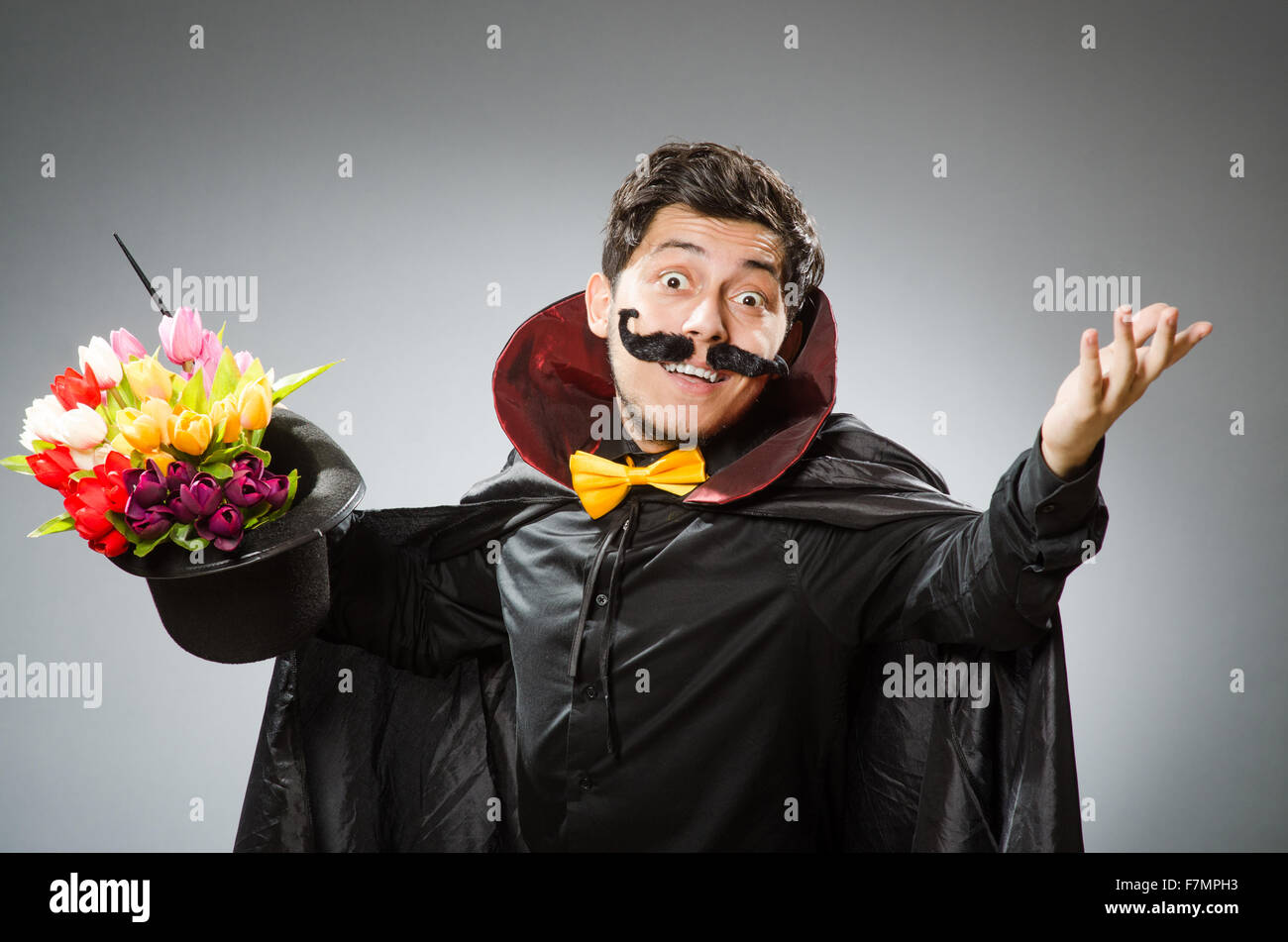 Funny magician man with wand and hat Stock Photo - Alamy
