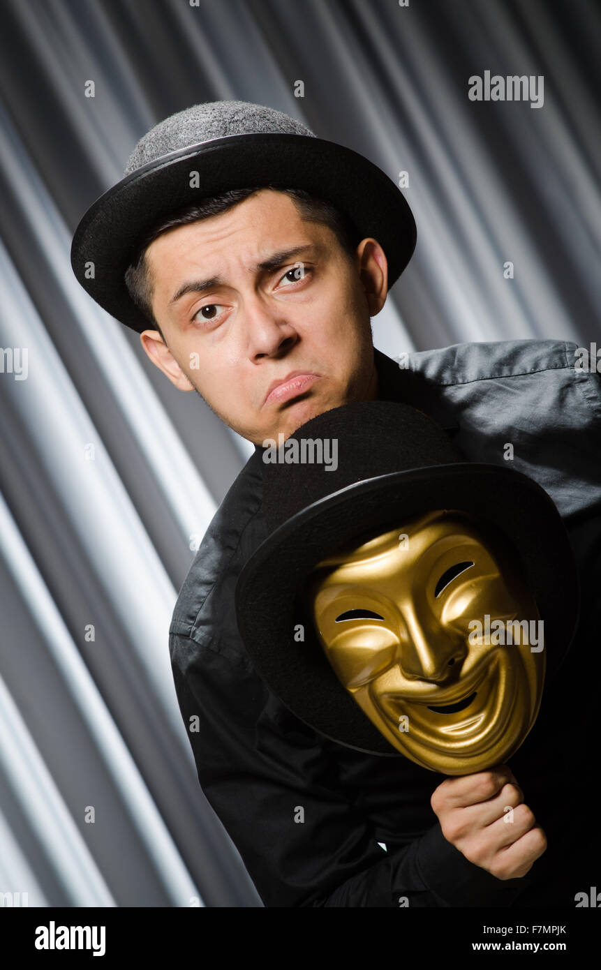 Funny concept with theatrical mask Stock Photo - Alamy