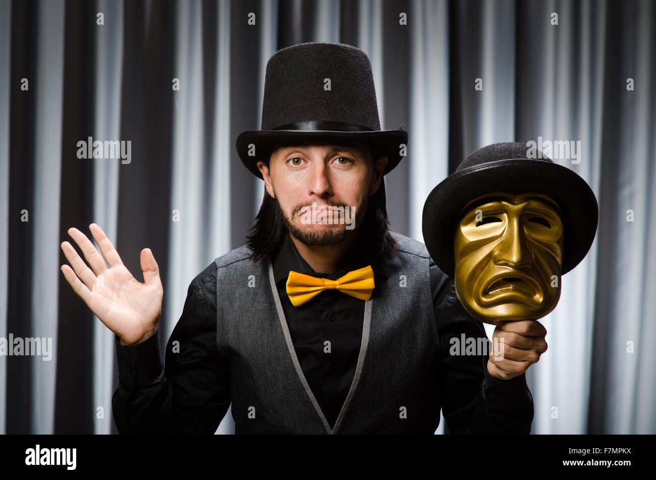 Funny concept with theatrical mask Stock Photo - Alamy