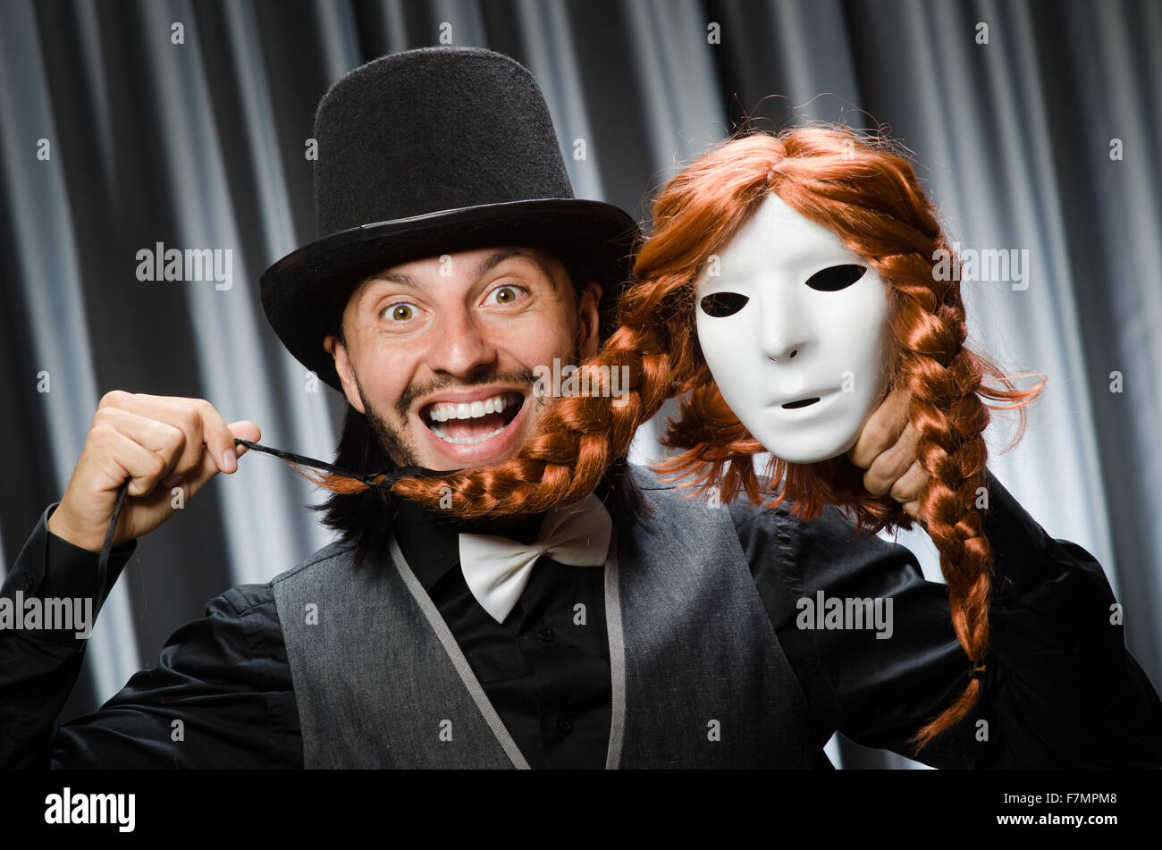 Funny concept with theatrical mask Stock Photo - Alamy