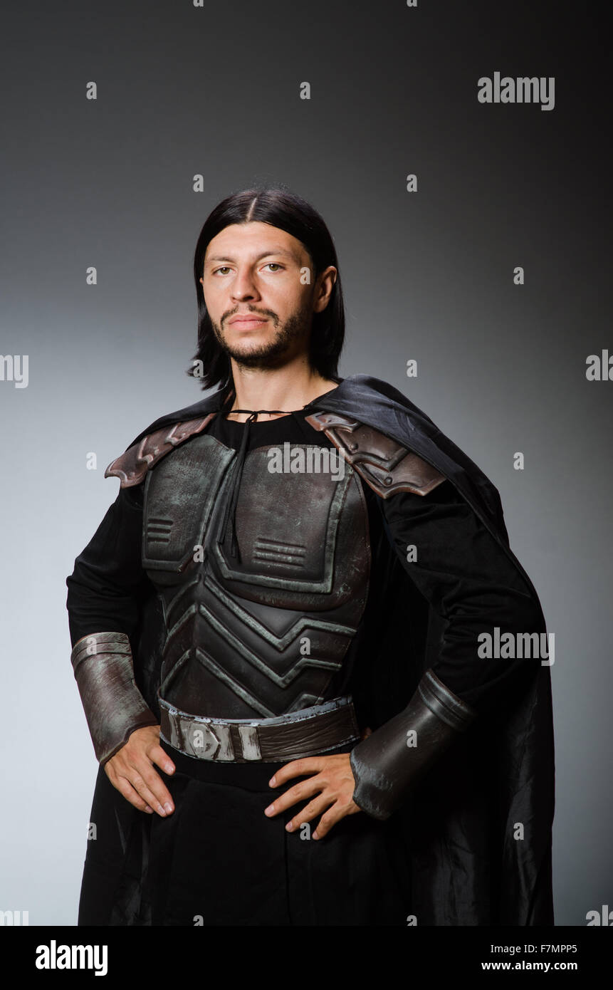 Angry warrior against dark background Stock Photo - Alamy