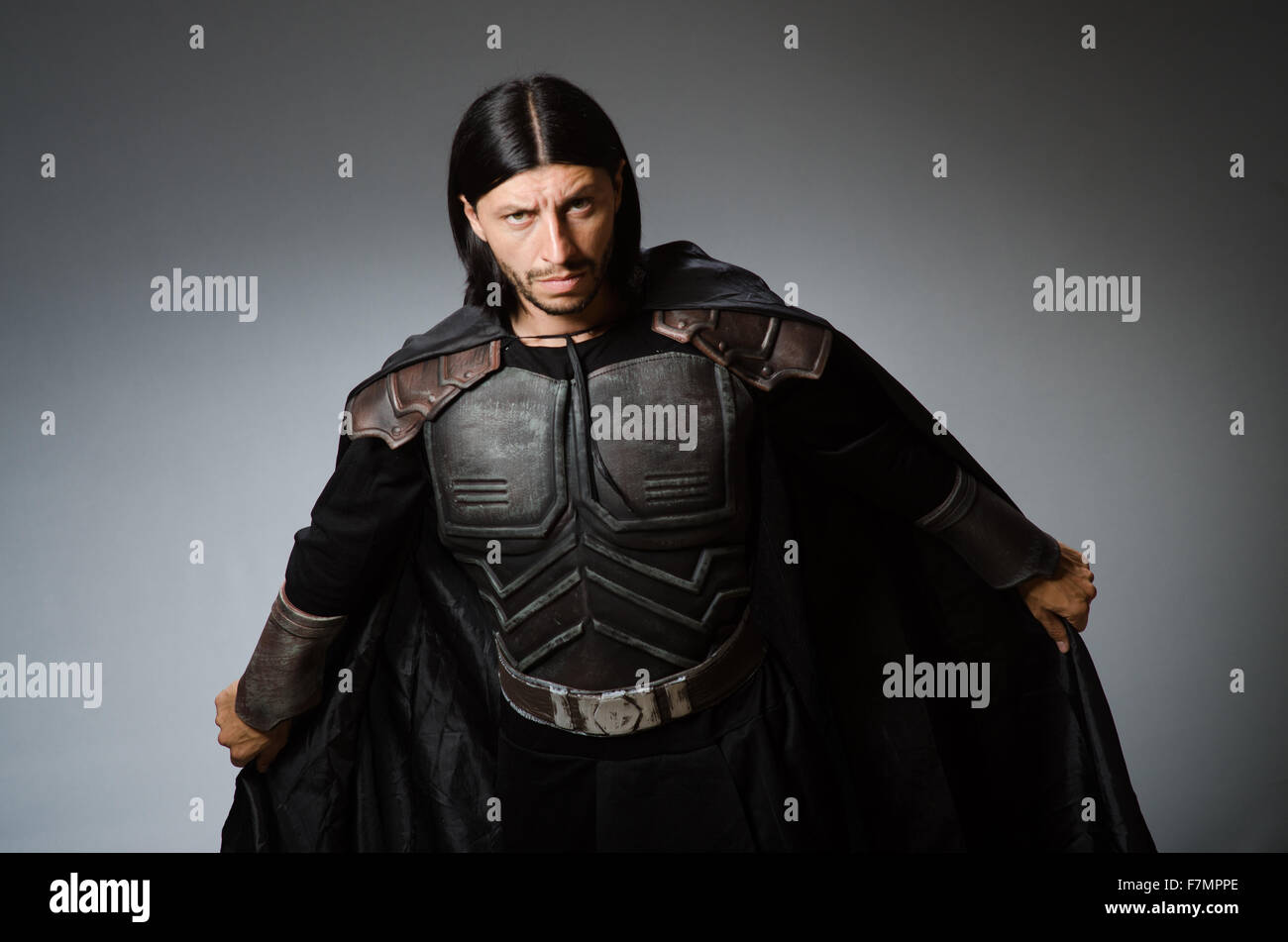 Angry warrior against dark background Stock Photo - Alamy