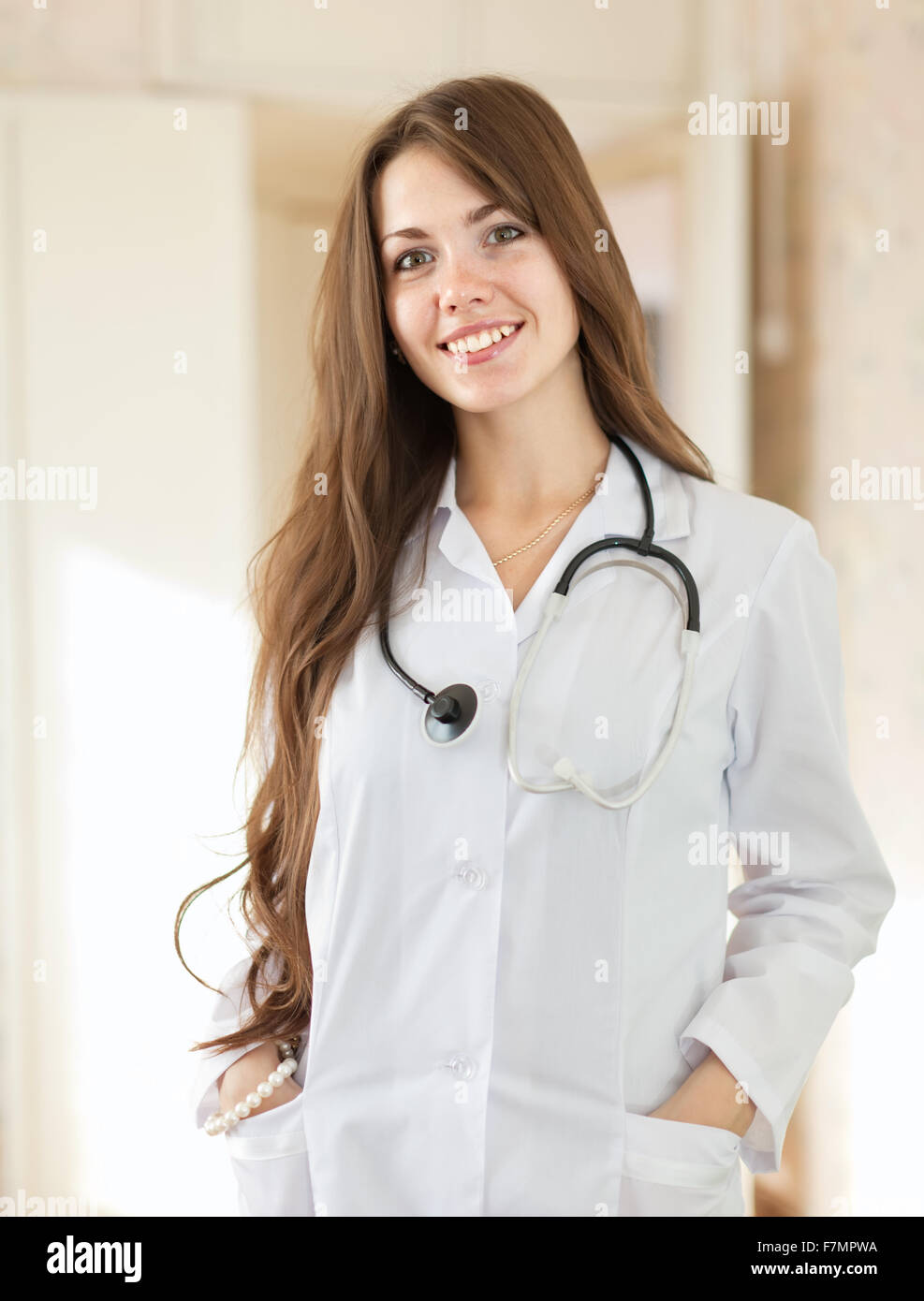 Portrait of friendly doctor in clinic interior Stock Photo - Alamy
