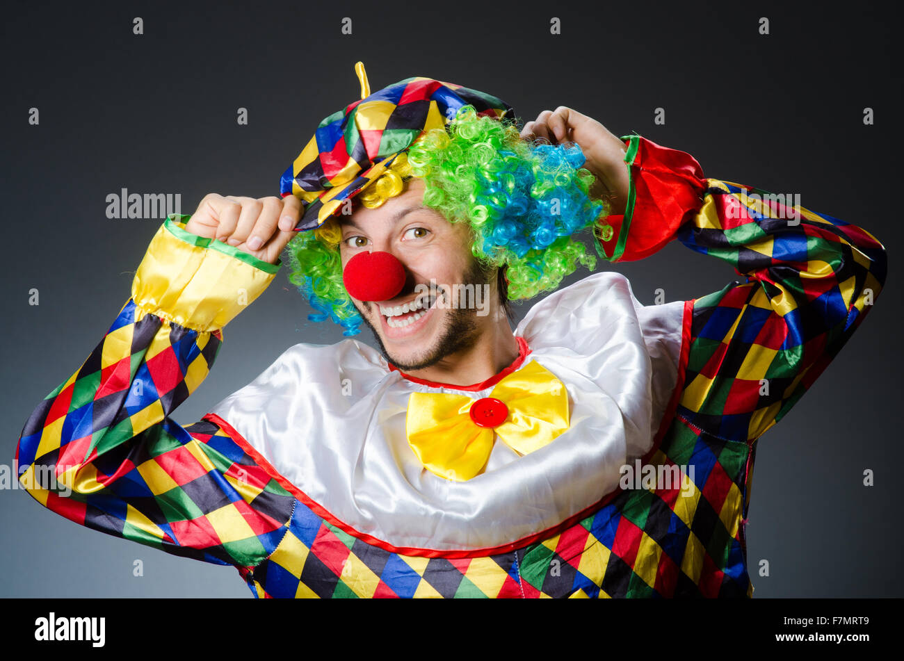 Funny clown in colourful costume Stock Photo - Alamy