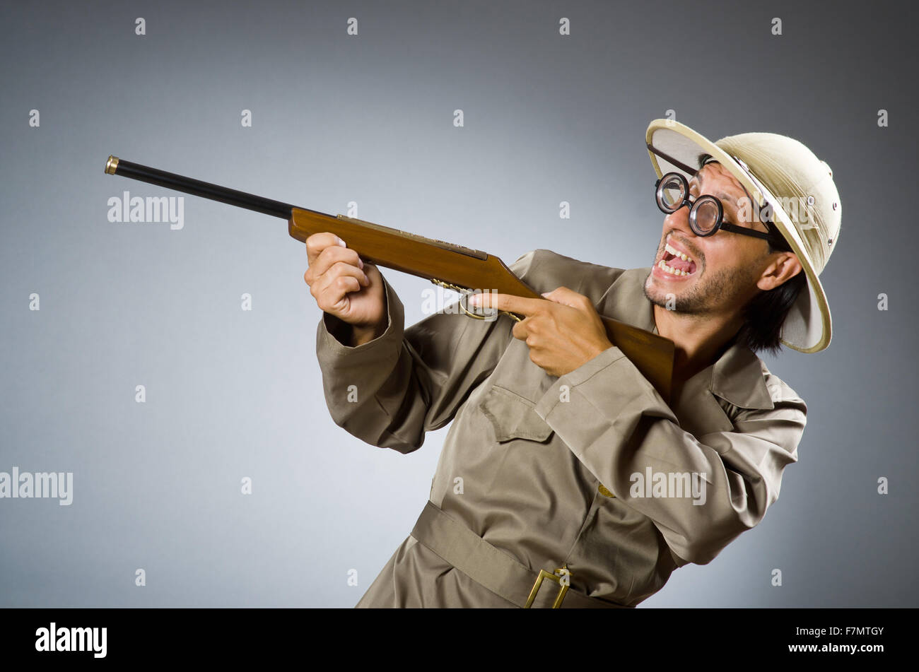 Funny safari hunter with rifle Stock Photo - Alamy