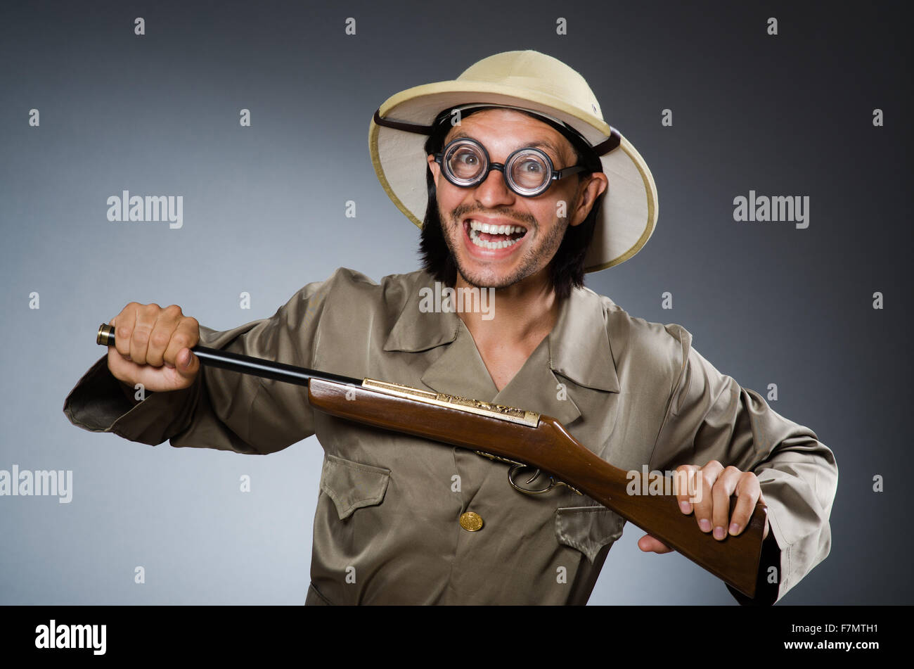 Funny safari hunter with rifle Stock Photo - Alamy
