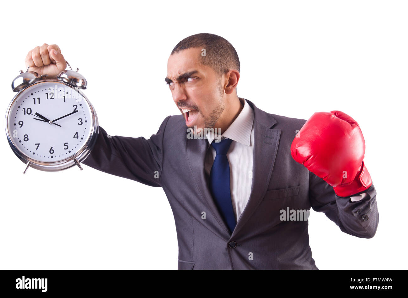 Angry businessman hitting clock isolated on white Stock Photo - Alamy