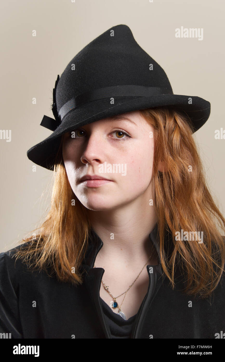 Redhead serious in black hat and jacket Stock Photo - Alamy
