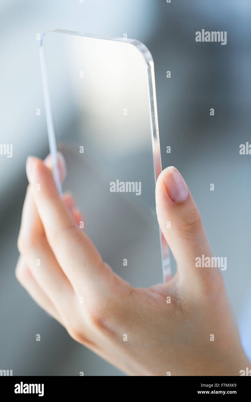 close up of woman with transparent smartphone Stock Photo - Alamy