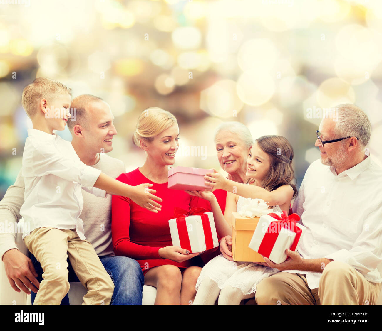 smiling family with gifts Stock Photo - Alamy