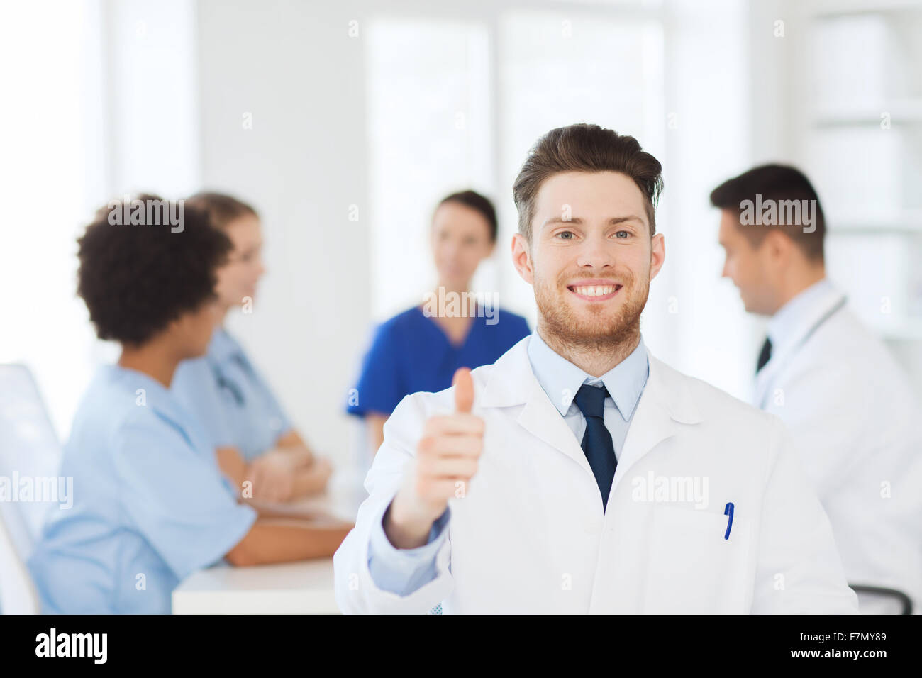 happy doctor over group of medics at hospital Stock Photo - Alamy