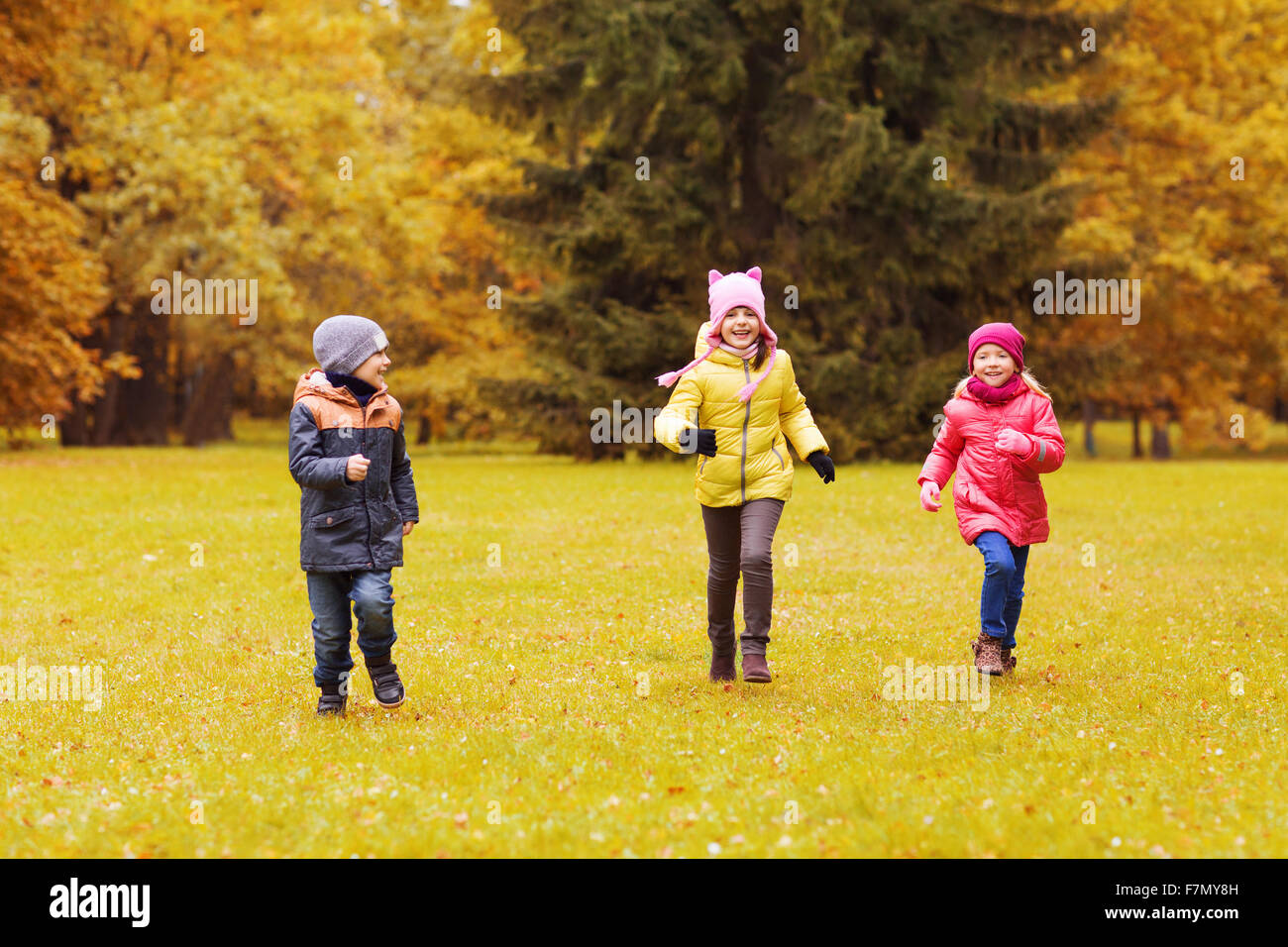 group of happy little kids running outdoors Stock Photo - Alamy
