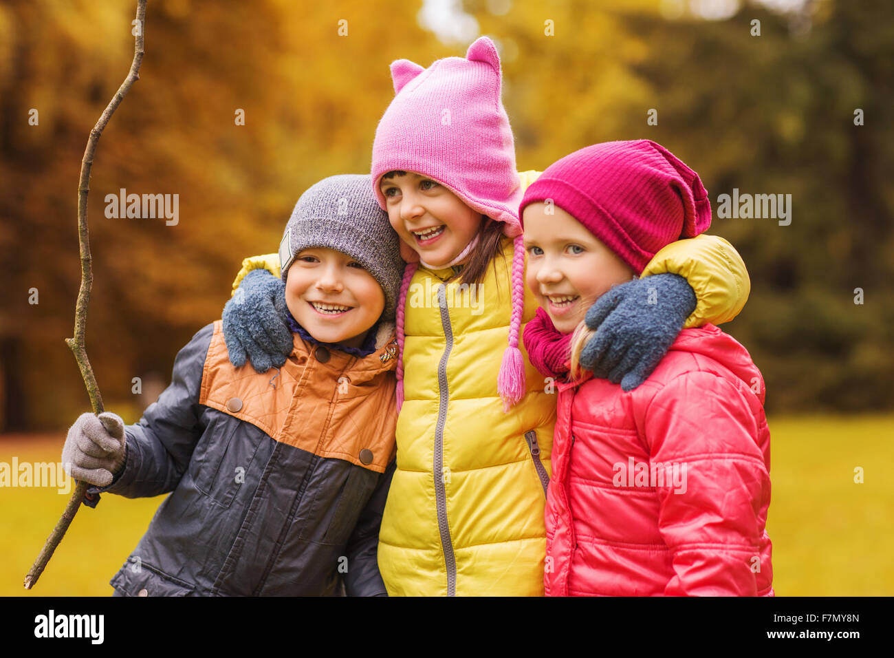 group of happy children hugging in autumn park Stock Photo - Alamy