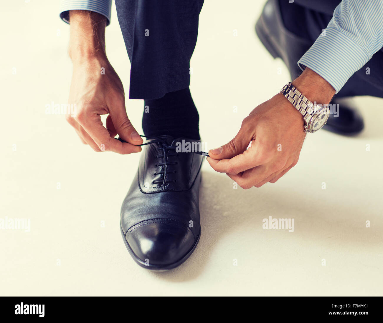 Tying shoe laces hi-res stock photography and images - Alamy