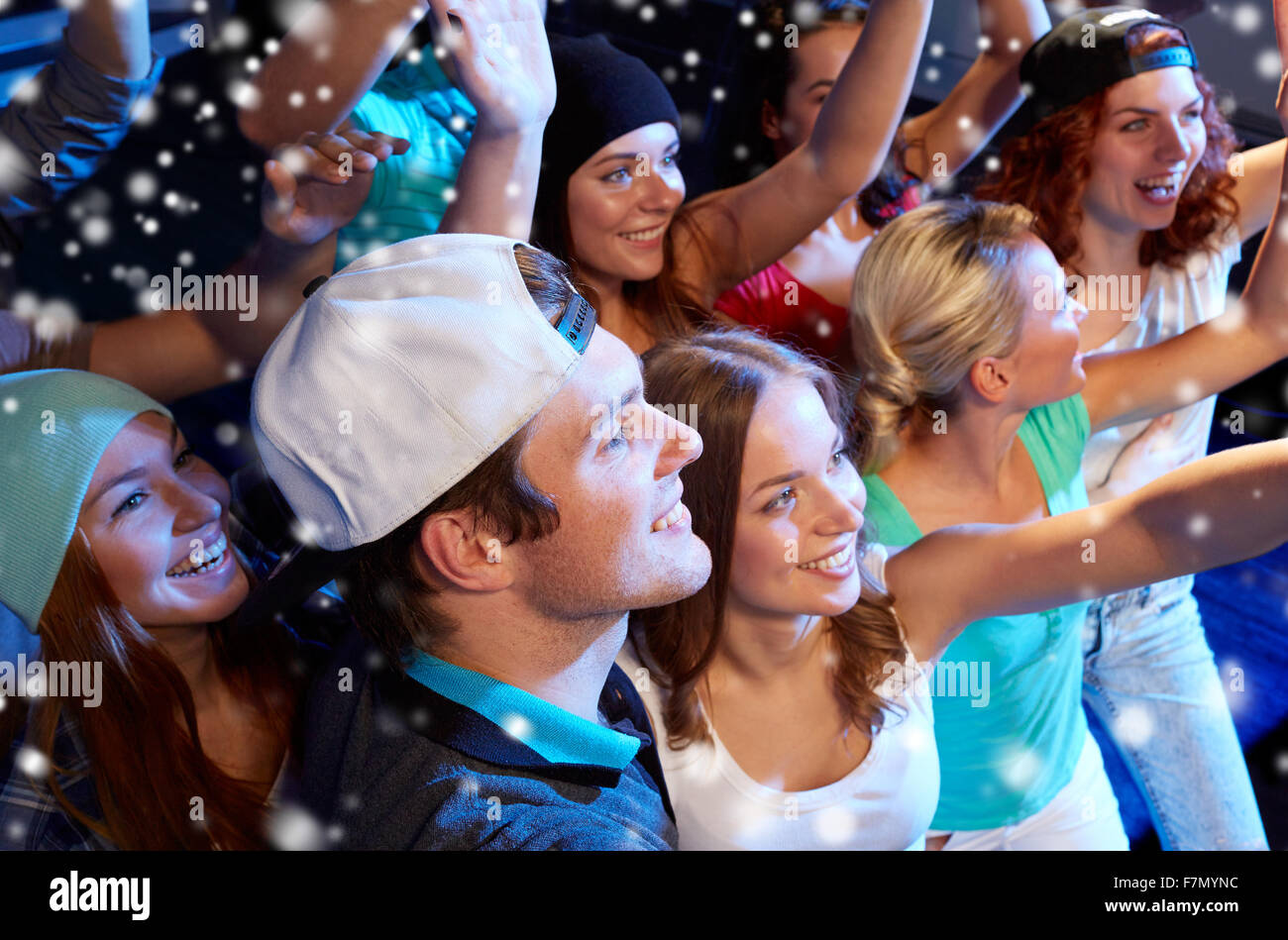 smiling friends at concert in club Stock Photo - Alamy