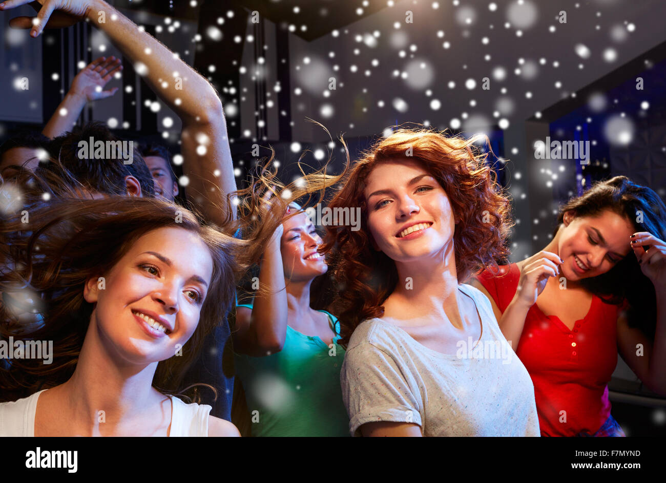 smiling friends dancing in club Stock Photo - Alamy