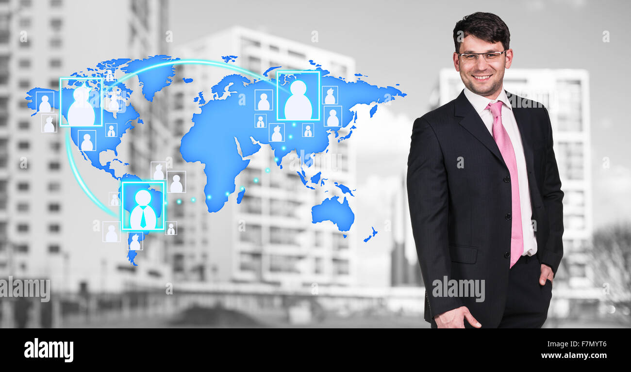 Businessman stands near map with icons Stock Photo - Alamy