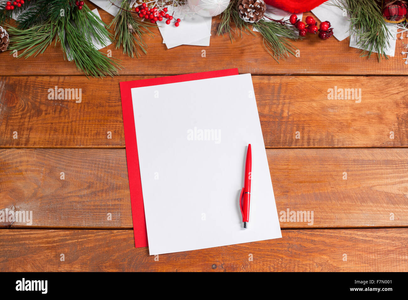 The blank sheet of paper on the wooden table with a pen Stock Photo - Alamy