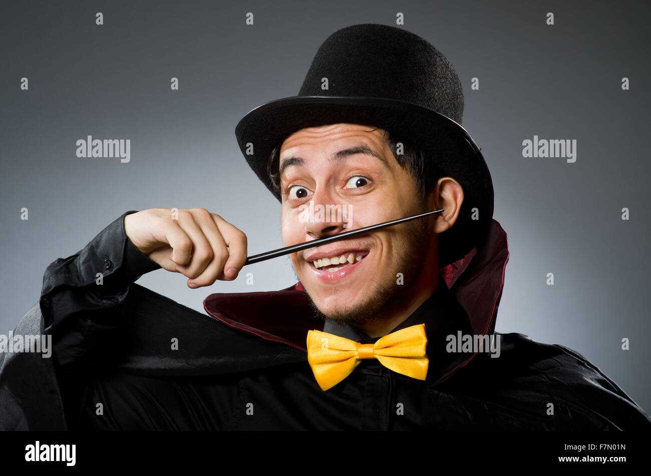 Funny magician man with wand and hat Stock Photo - Alamy