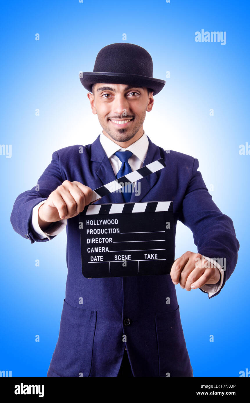 Man with movie clapper isolated on white Stock Photo - Alamy