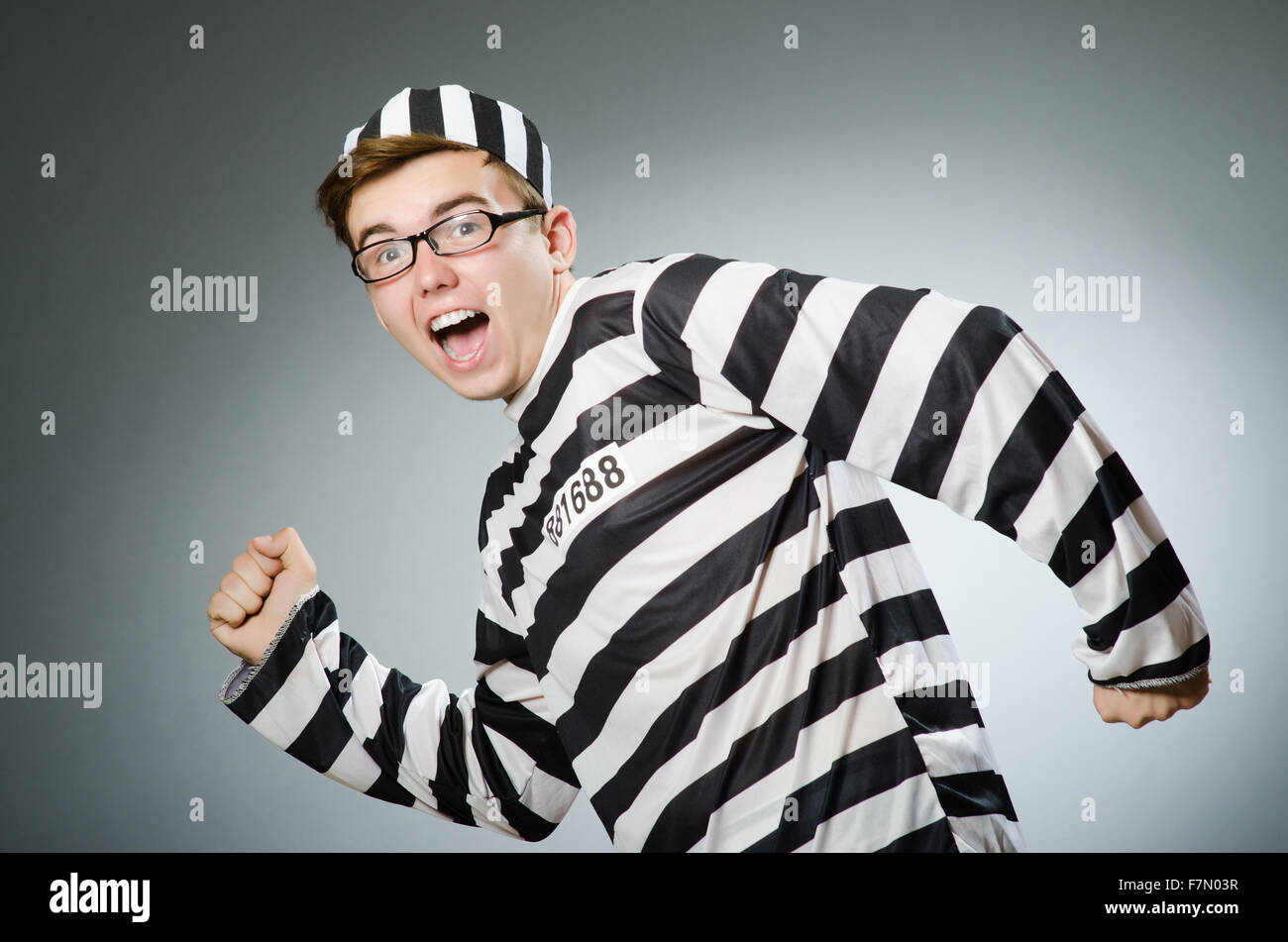 Prison inmate in funny concept Stock Photo - Alamy