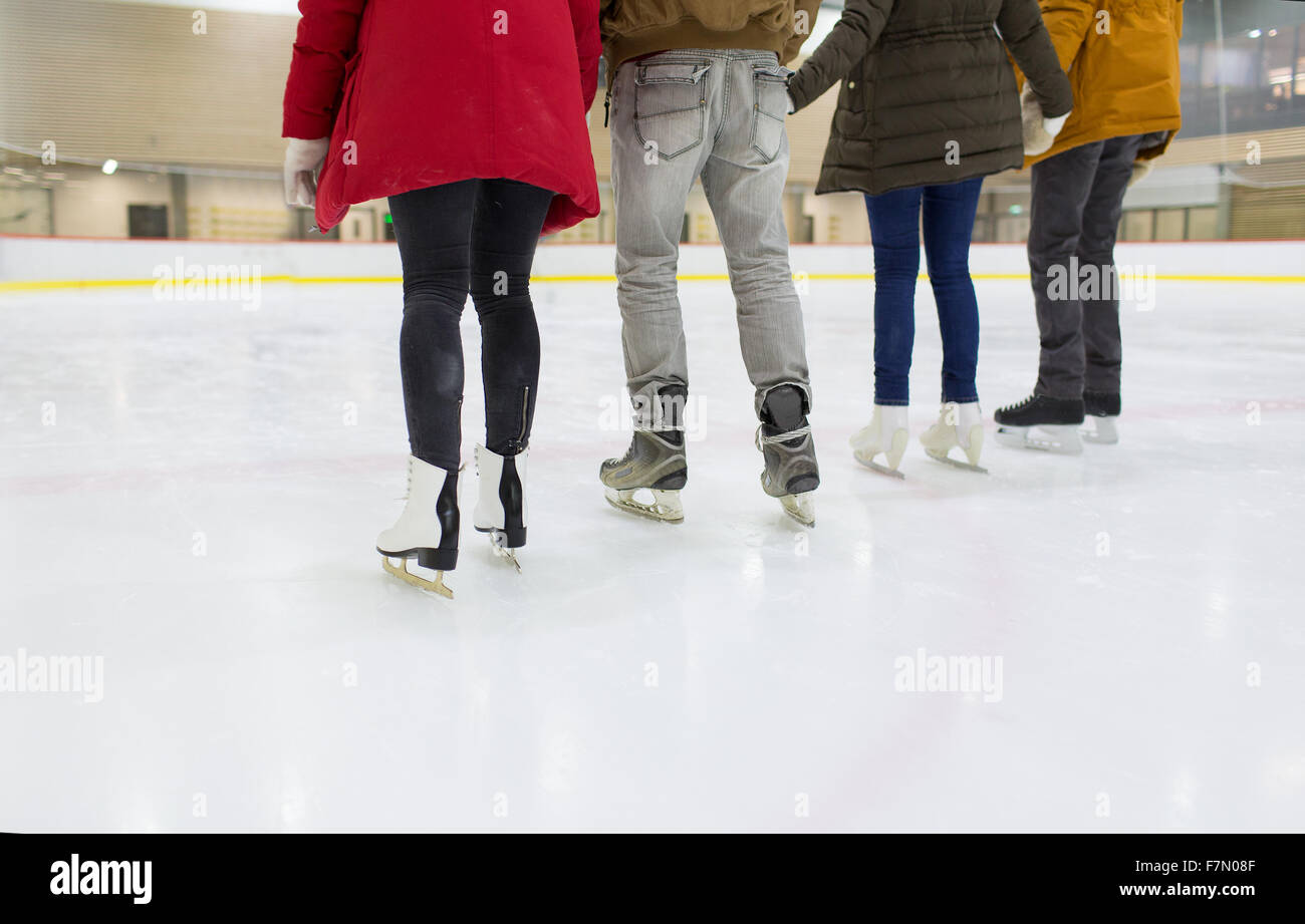 close up of happy friends skating on ice rink Stock Photo - Alamy