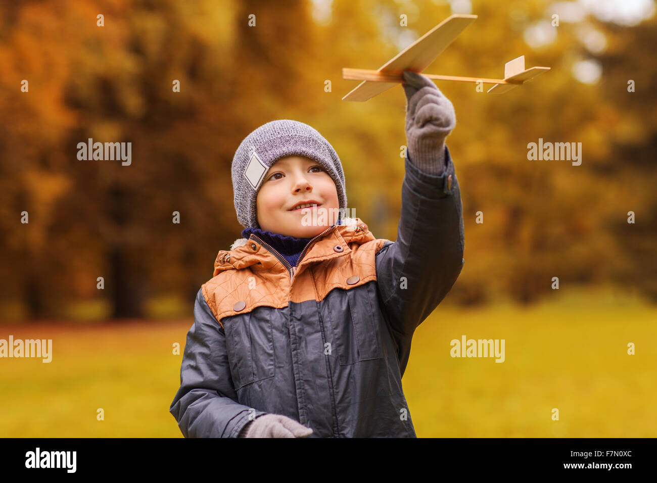 happy little boy playing with toy plane outdoors Stock Photo - Alamy
